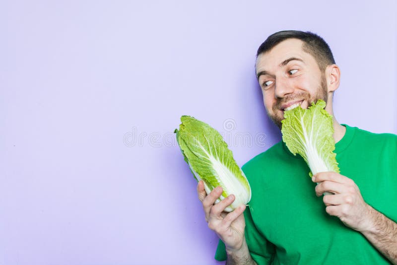 Young Man Biting on a Leaf of Beijing Napa Cabbage Stock Image - Image ...