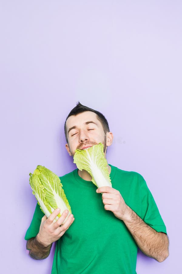 Young Man Biting on a Leaf of Beijing Napa Cabbage Stock Image - Image ...