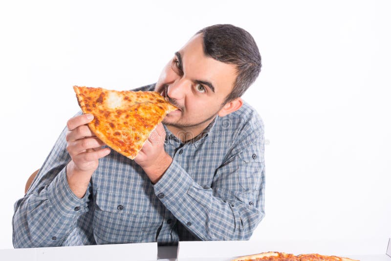 Young Man Biting a Piece of Vegetarian Pizza Stock Photo - Image of ...