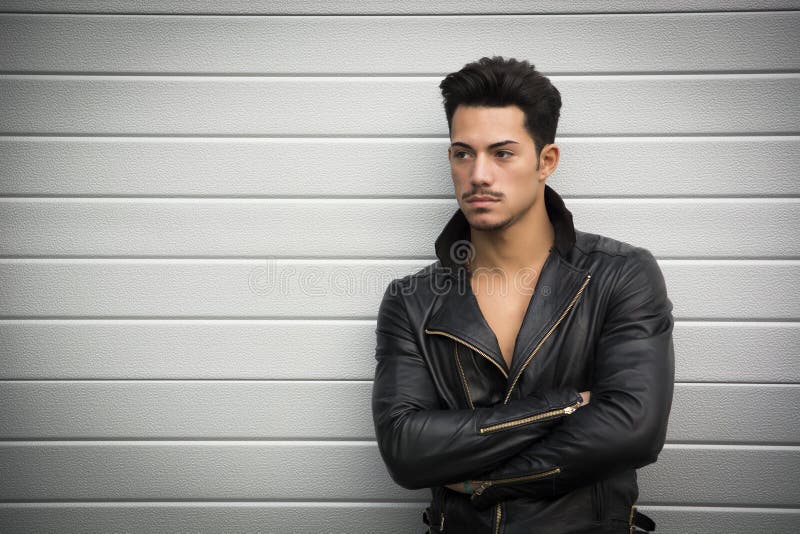 Young Man with Black Leather Jacket, Arms Crossed Stock Image - Image ...