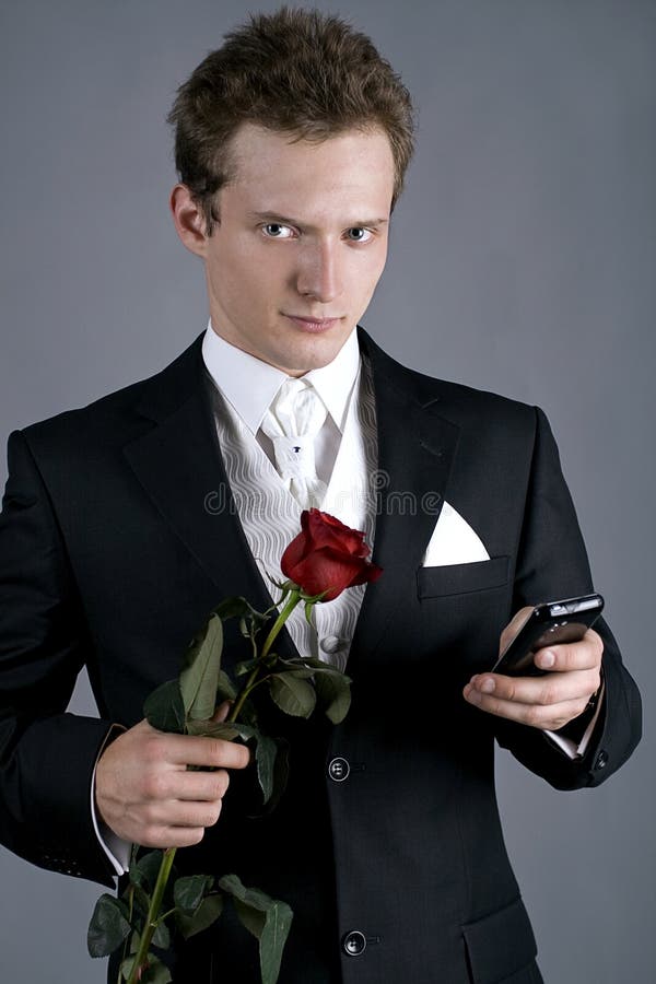 Young Man Gives You a Red Rose Stock Photo - Image of dressed, thanks ...