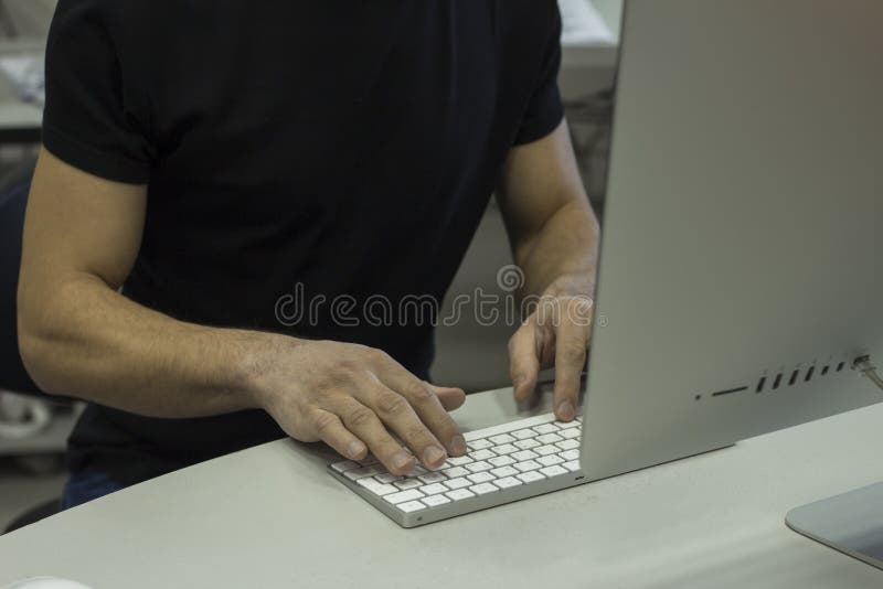 Young Man in a Black T-shirt Working with Computer, Man S Hands on ...