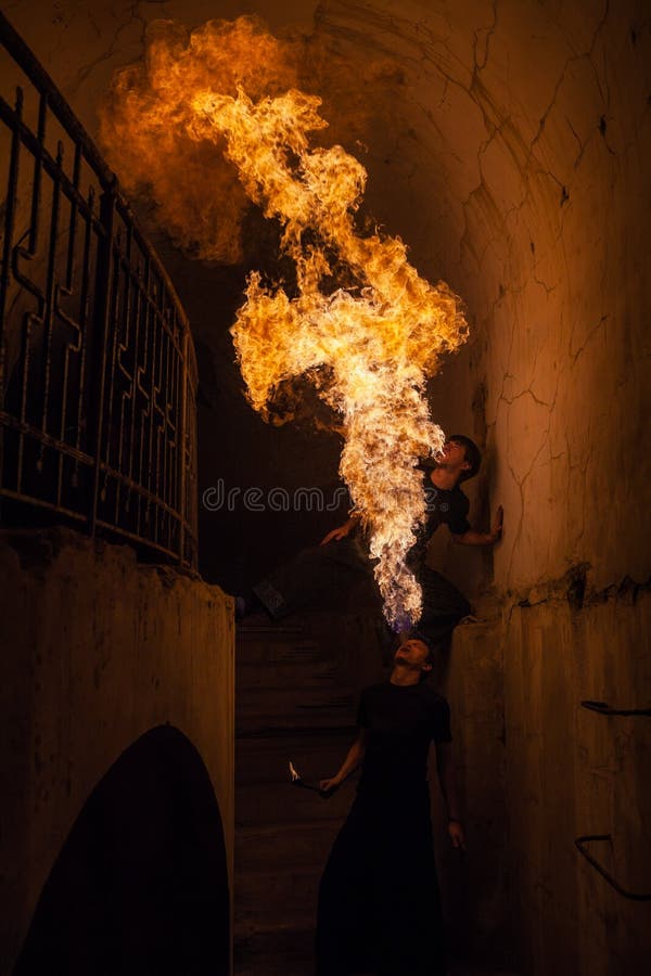 Young Man Blowing Fire from His Mouth Stock Image - Image of artist ...