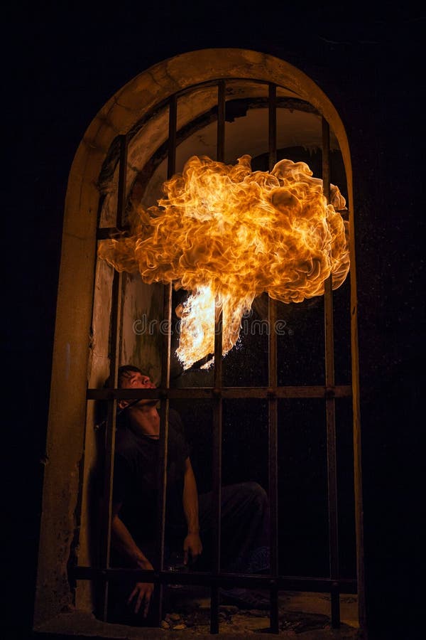 Young Man Blowing Fire from His Mouth Stock Image - Image of artist ...