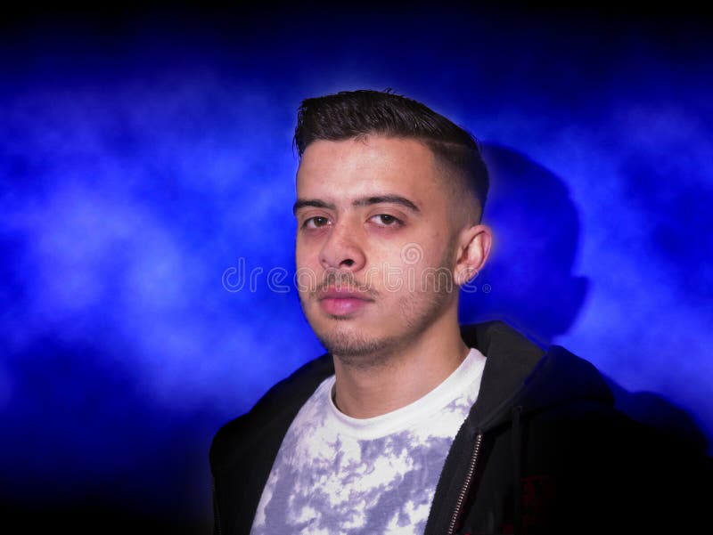 Young Man on a Blue Background Stock Photo - Image of alone, blue: 40221006