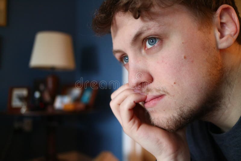 A Young Man with Blue Eyes Looking at Something Off Camera. Stock Photo ...