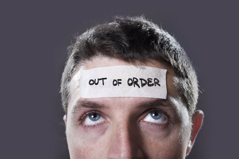 Young Man with Blue Eyes and Tape Text Out of Order on Forehead in Dry ...