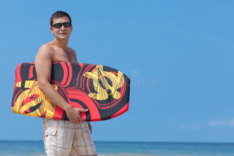Young Man with Boogie Board Stock Photo - Image of ocean, handsome ...