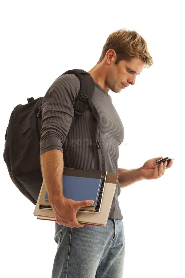 Young Man with Books and Backpack on Cell Phone Stock Photo - Image of ...