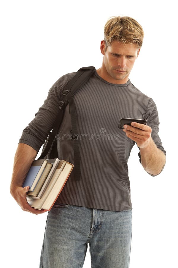 Young Man with Books and Backpack on Cell Phone Stock Photo - Image of ...