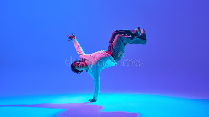 Young Breakdancer Balancing on One Hand Against White Background. Ffull ...