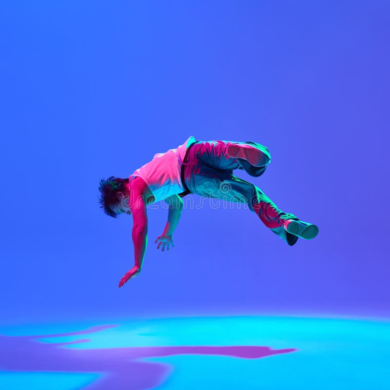 Young Breakdancer Balancing on One Hand Against White Background. Ffull ...
