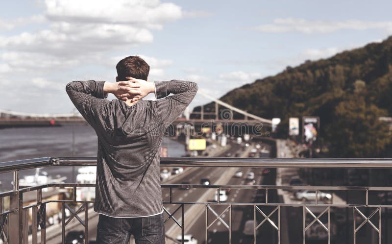 Young Man on a Bridge in a Big City Stock Image - Image of highway ...