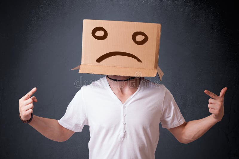 Young Man with a Brown Cardboard Box on His Head with Sad Face Stock ...