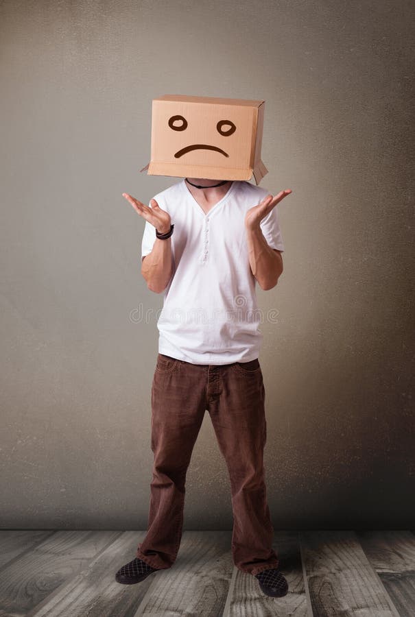 Young Man with a Brown Cardboard Box on His Head with Sad Face Stock ...