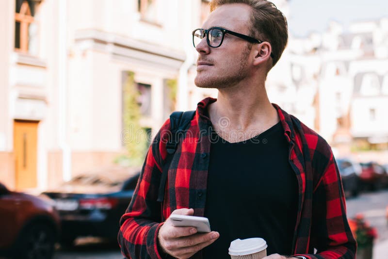 Young Man Browsing Phone during Stroll in Street Stock Photo - Image of ...