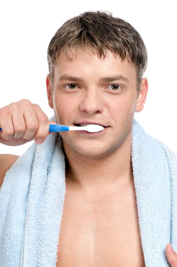 Young man brushing teeth stock image. Image of male, hold - 19881529