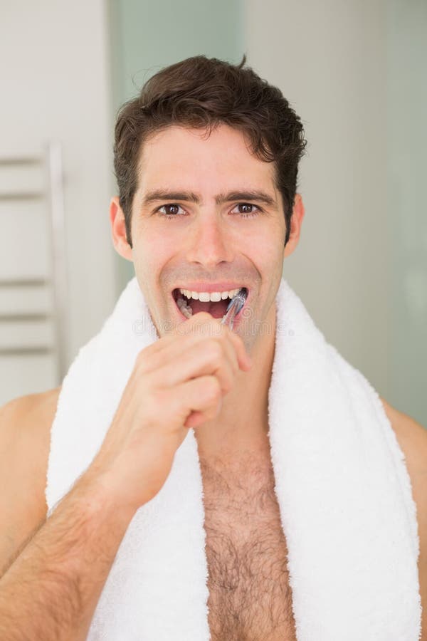 Young Man Brushing Teeth in the Bathroom Stock Image - Image of 2529 ...