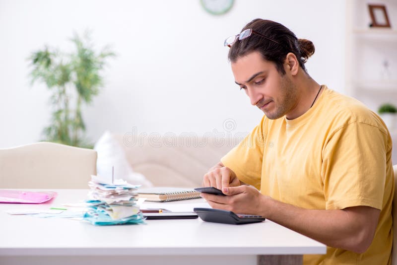 Young Man in Budget Planning Concept Stock Photo - Image of counting ...