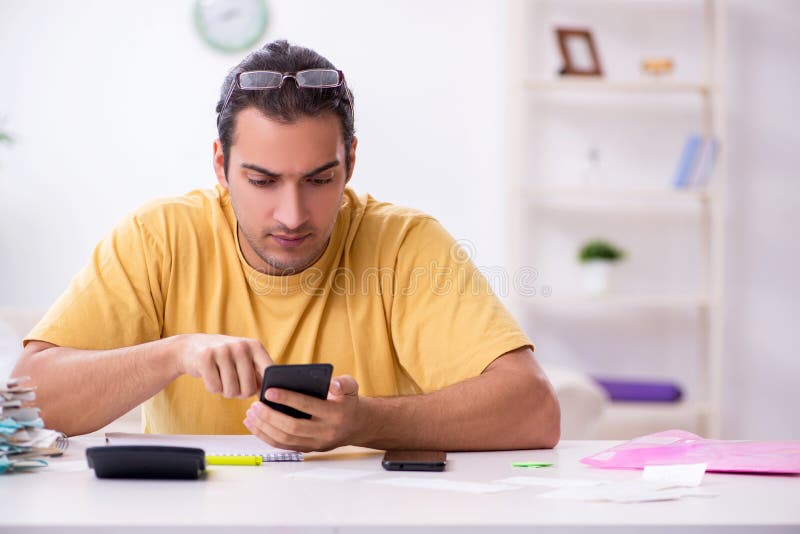 Young Man in Budget Planning Concept Stock Photo - Image of mortgage ...