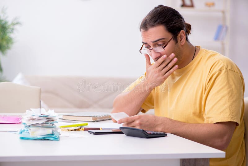 Young Man in Budget Planning Concept Stock Photo - Image of counting ...
