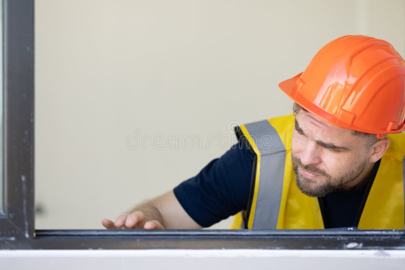 Young Man Builder Construction Worker Look Precise Level of Windows ...
