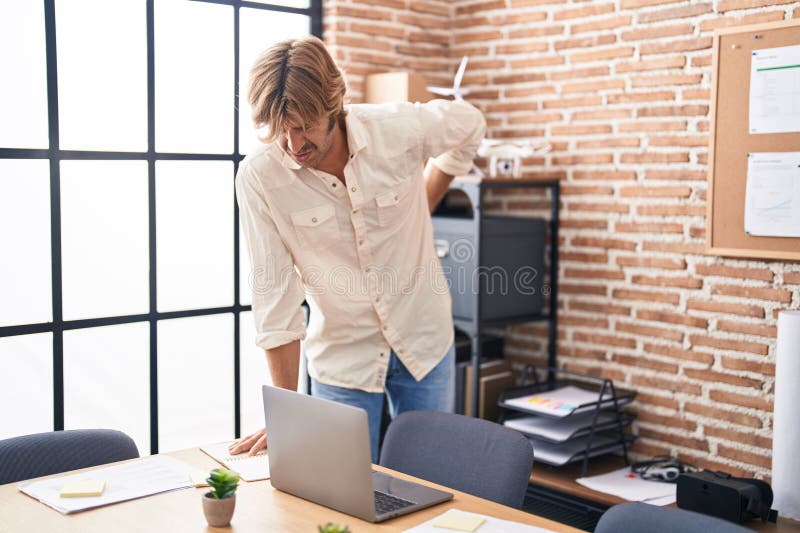 Young Man Business Worker Suffering for Back Ache at Office Stock Photo ...