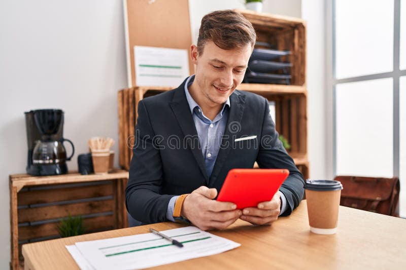 Young Man Business Worker Using Touchpad Working at Office Stock Photo ...