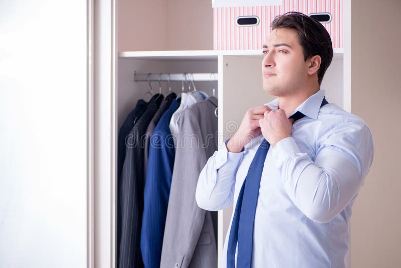 The Young Man Businessman Getting Dressed for Work Stock Image - Image ...