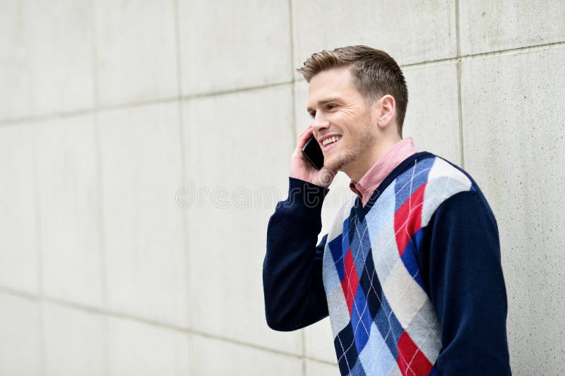 Young Man Busy in a Phone Conversation Stock Photo - Image of lifestyle ...
