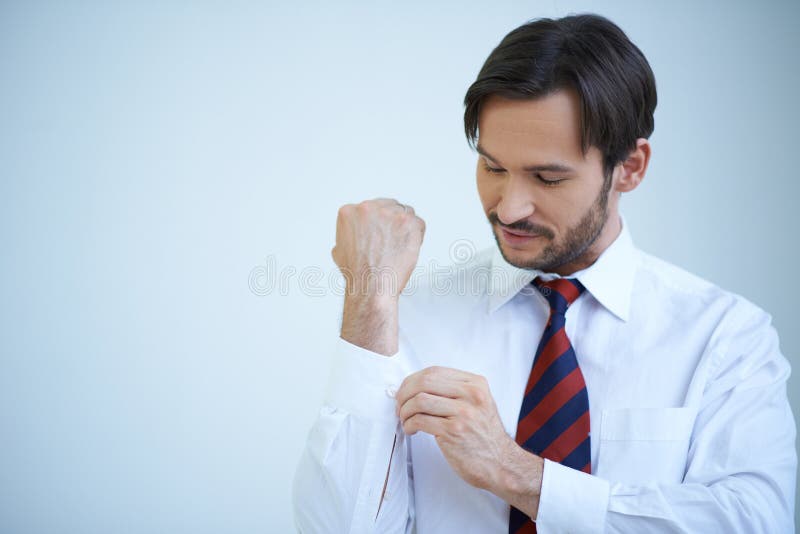 Young Man Buttoning His Cuffs Stock Photo - Image of copysapce ...