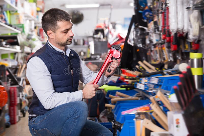 Young Man is Buying New Adjustable Wrench Stock Image - Image of tool ...