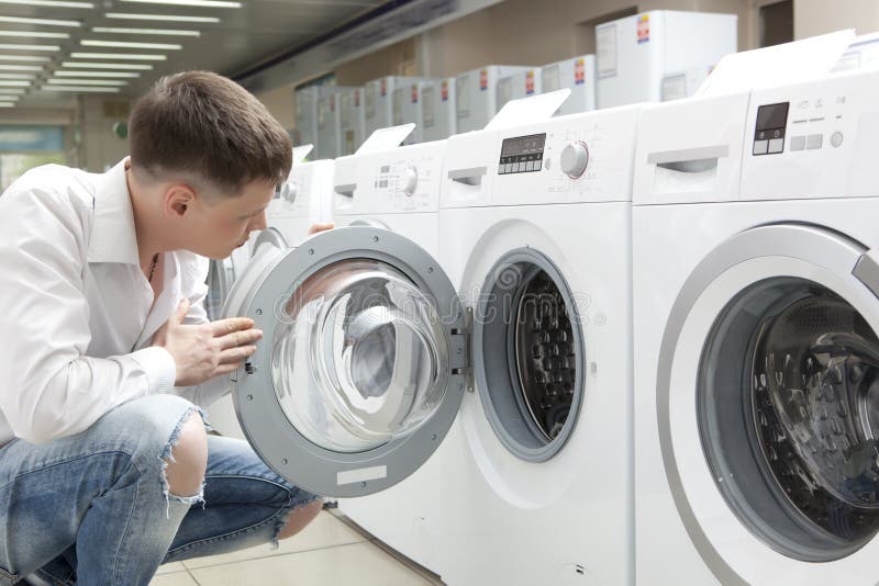 Young Man Buying New Washing Machine Stock Photo - Image of hatch, hand ...
