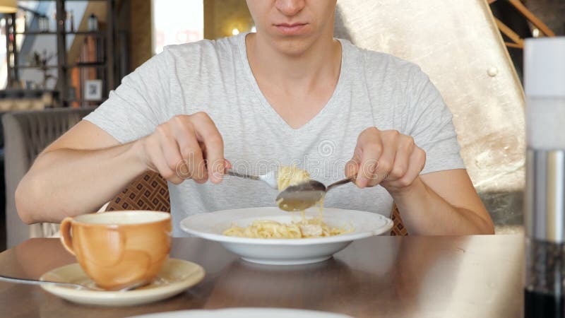 Young Man in a Cafe with an Appetite Eating a Paste Stock Video - Video ...
