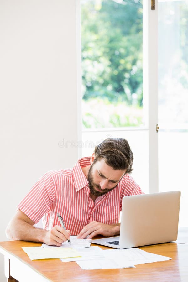 Young Man Calculating His Bills Stock Image - Image of browsing ...