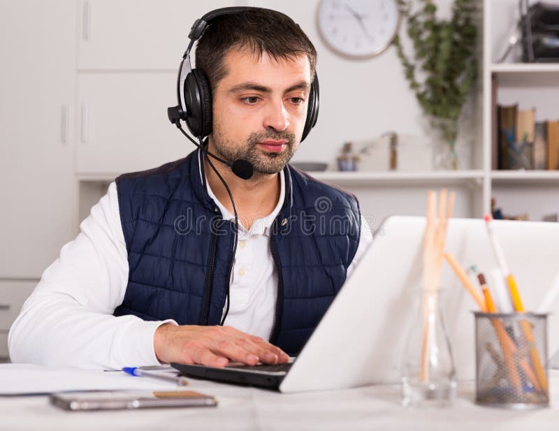 Young Man Call Centre Operator with Headphones Working Stock Photo ...