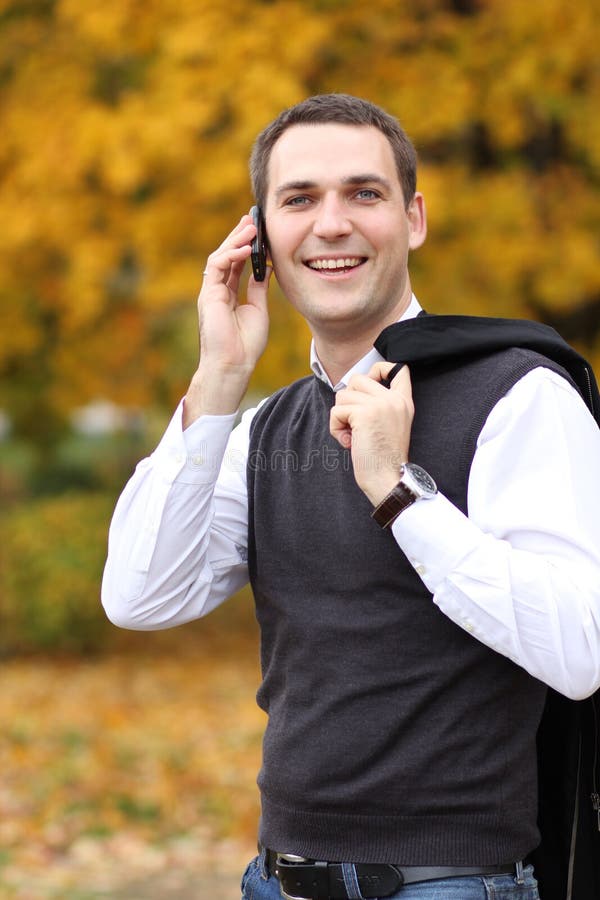 Young Man Calling by Phone in the Street Stock Image - Image of calling ...