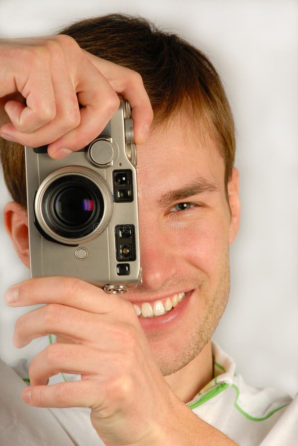 Young man with camera stock photo. Image of snapshot, color - 2296656