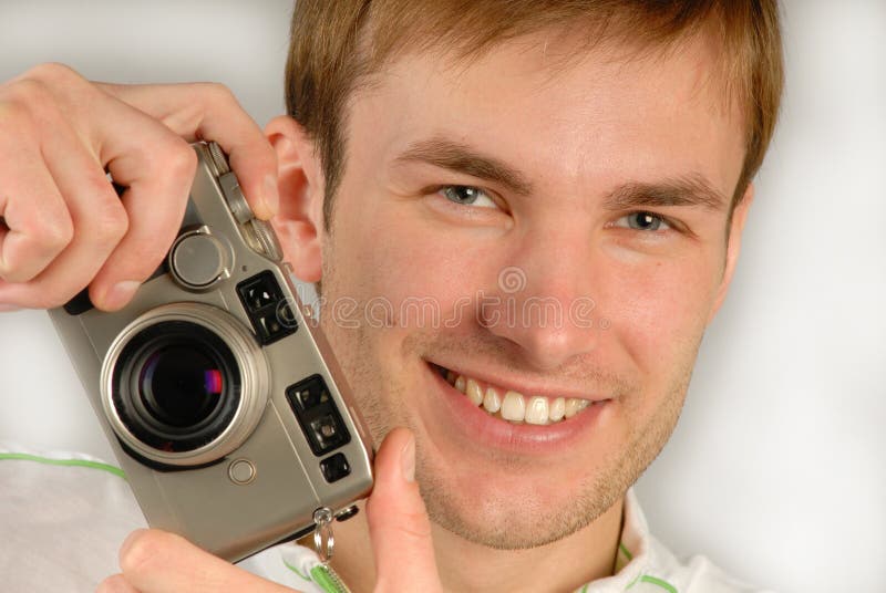 Young man with camera stock photo. Image of photographer - 2296658