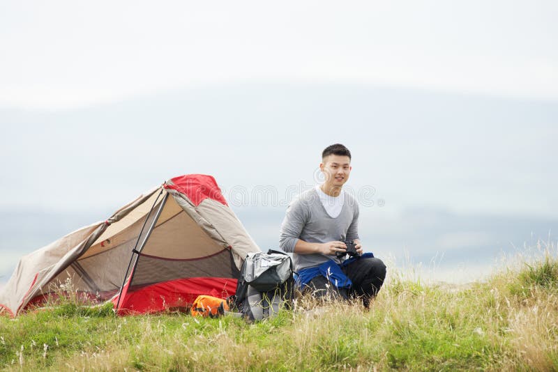 Young Man on Camping Trip in Countryside Stock Photo - Image of chinese ...