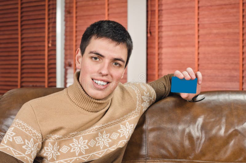 Young man with card stock image. Image of sitting, casual - 28631431