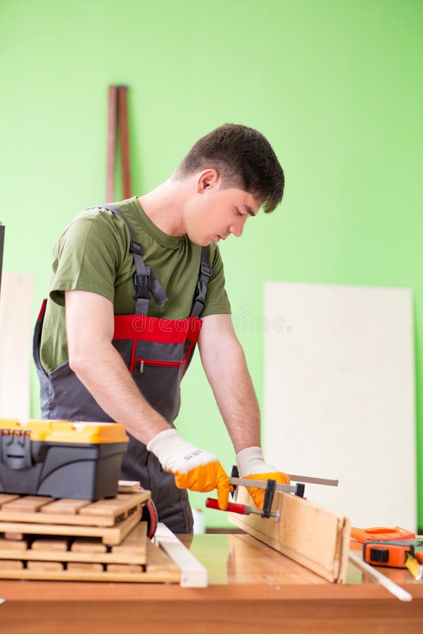 The Young Man Carpenter Working in Workshop Stock Image - Image of ...
