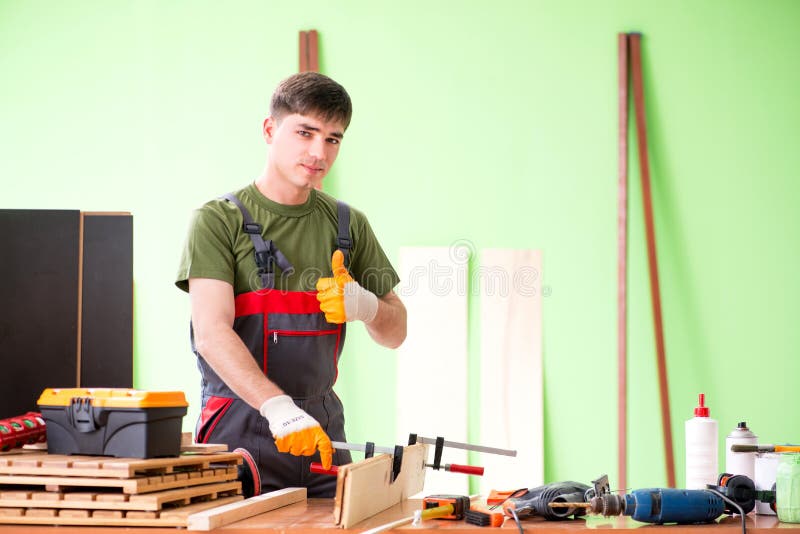 The Young Man Carpenter Working in Workshop Stock Image - Image of ...