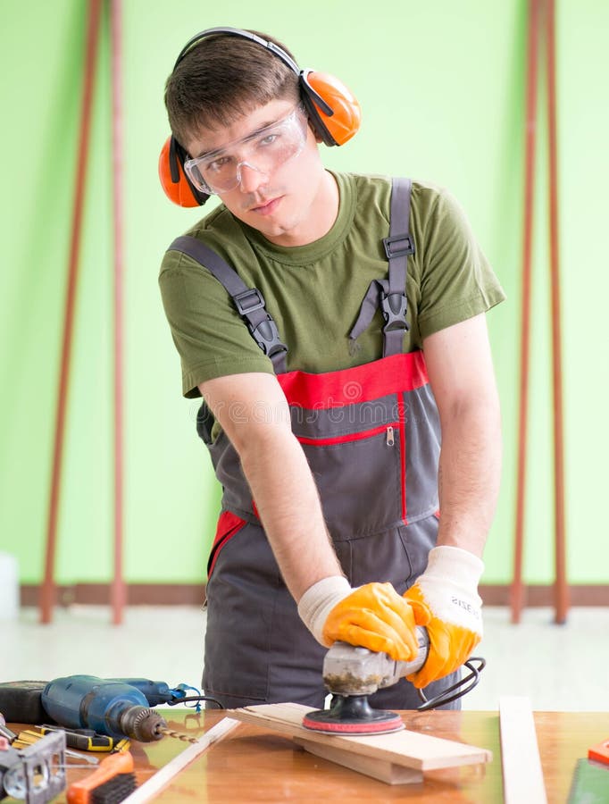 Young Man Carpenter Working in Workshop Stock Photo - Image of ...
