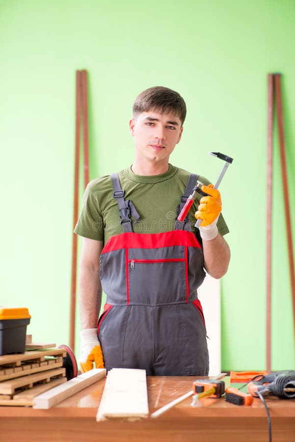 The Young Man Carpenter Working in Workshop Stock Photo - Image of ...