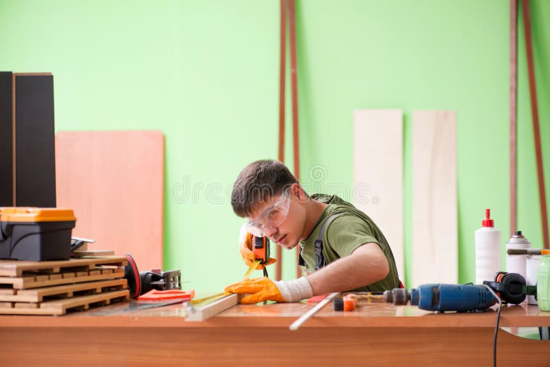 The Young Man Carpenter Working in Workshop Stock Image - Image of ...