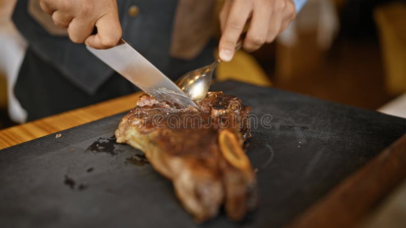 Young Man Carving Meat at the Restaurant Stock Photo - Image of male ...