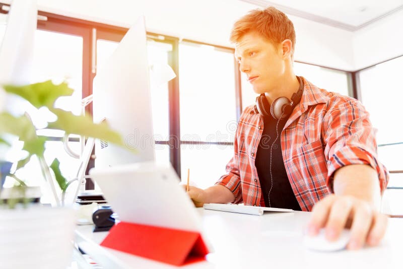 Young Man Working in Office Stock Photo - Image of lifestyle ...