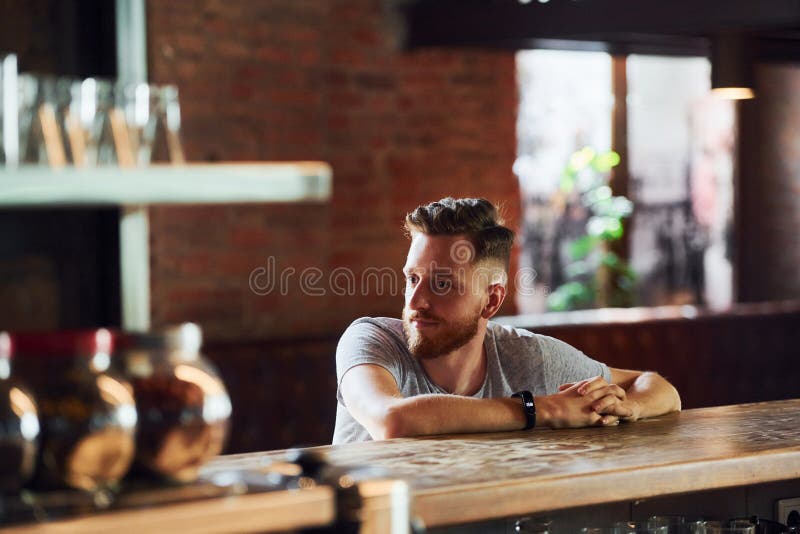 Young Man in Casual Clothes Sitting in the Pub Stock Photo - Image of ...