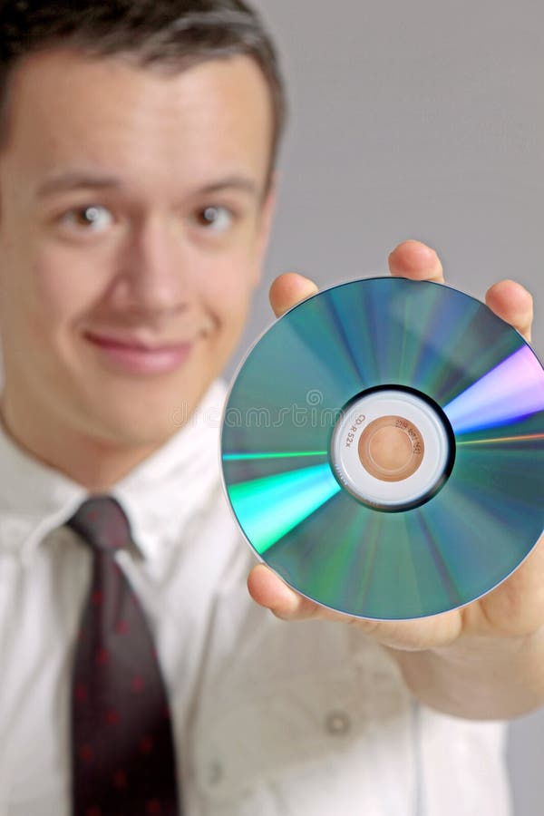 Young boy with cd stock image. Image of circle, coat, disk - 5253611
